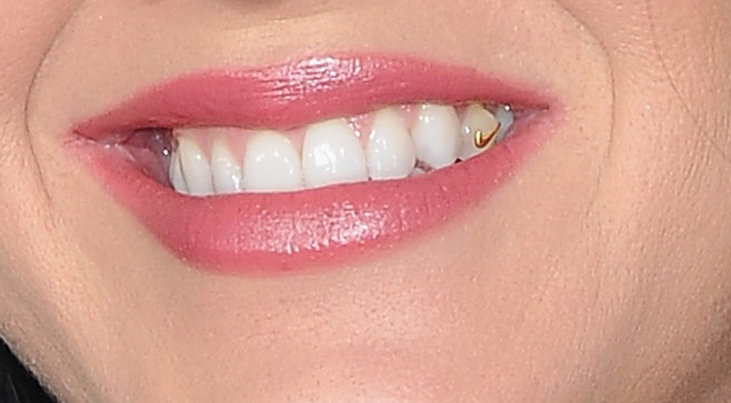So No Big Deal, But Katy Perry Totally Has A Gold Nike Symbol Stuck To ...